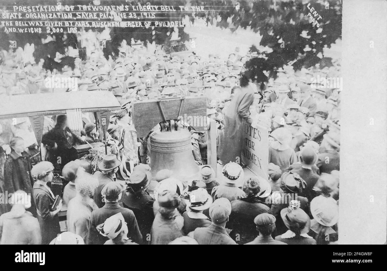 A large crowd surrounds a truck carrying the Justice Bell, a replica of ...