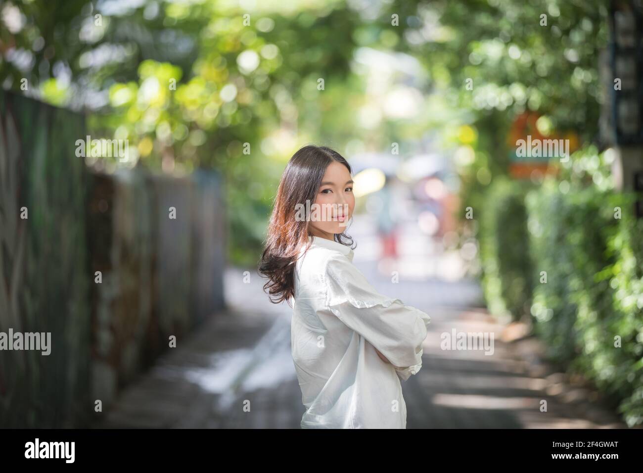 Portrait young woman thinking and looking modern style in outdoor urban ...