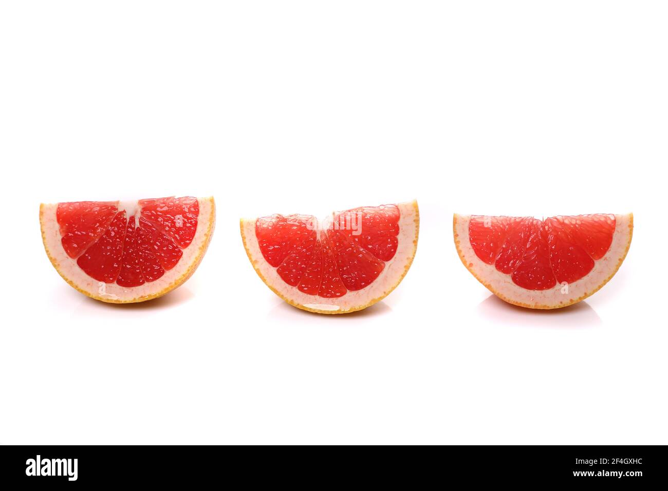 Grapefruit sliced isolated in white background Stock Photo - Alamy