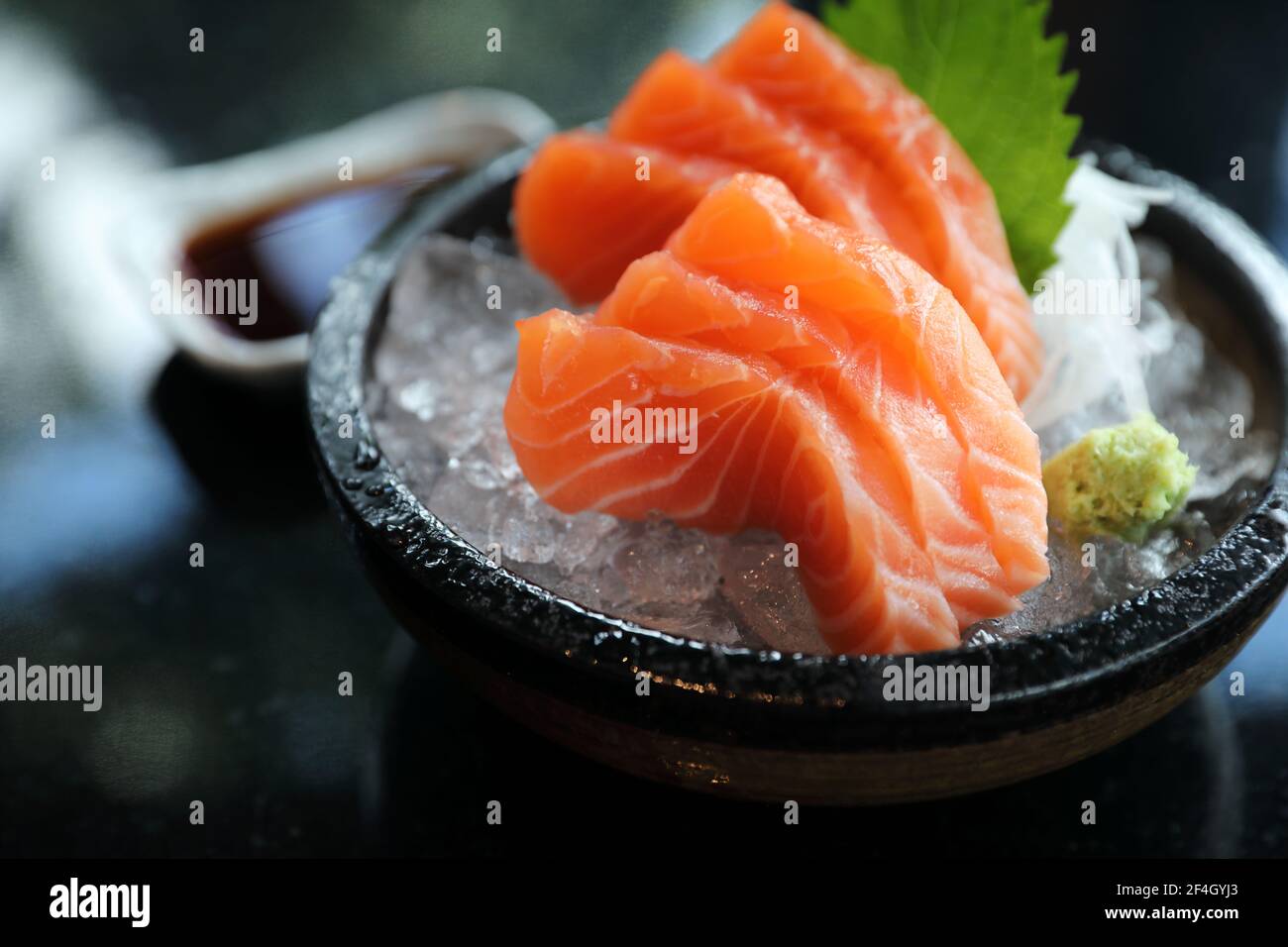 Salmon sashimi on ice Japanese food Stock Photo - Alamy