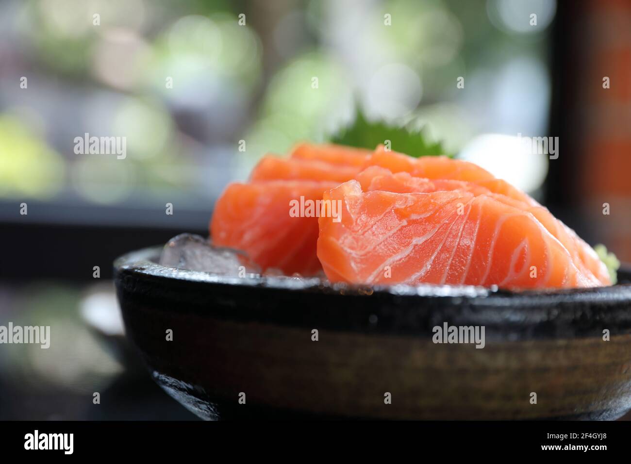 Salmon sashimi on ice Japanese food Stock Photo - Alamy