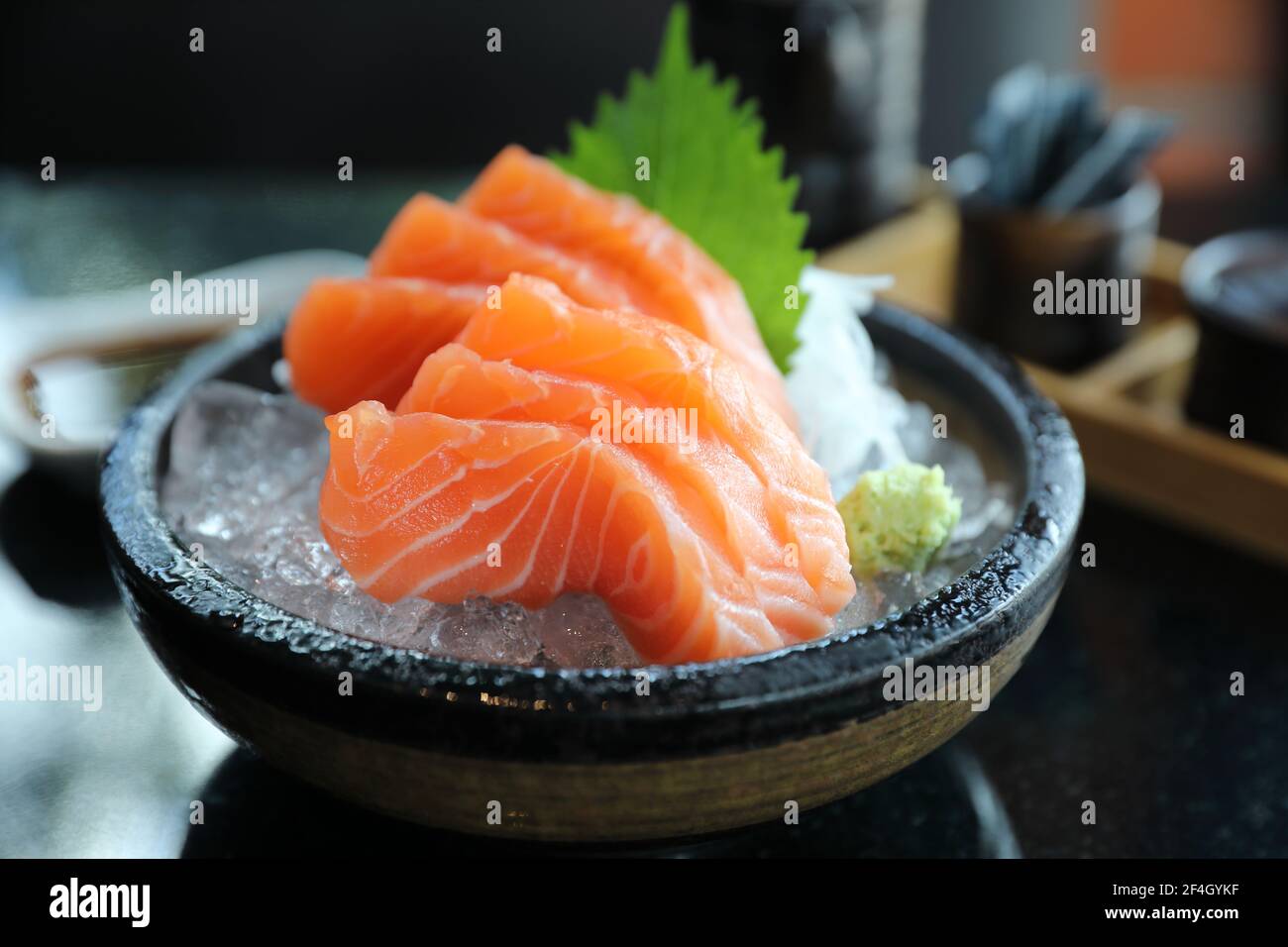 Salmon sashimi on ice Japanese food Stock Photo - Alamy