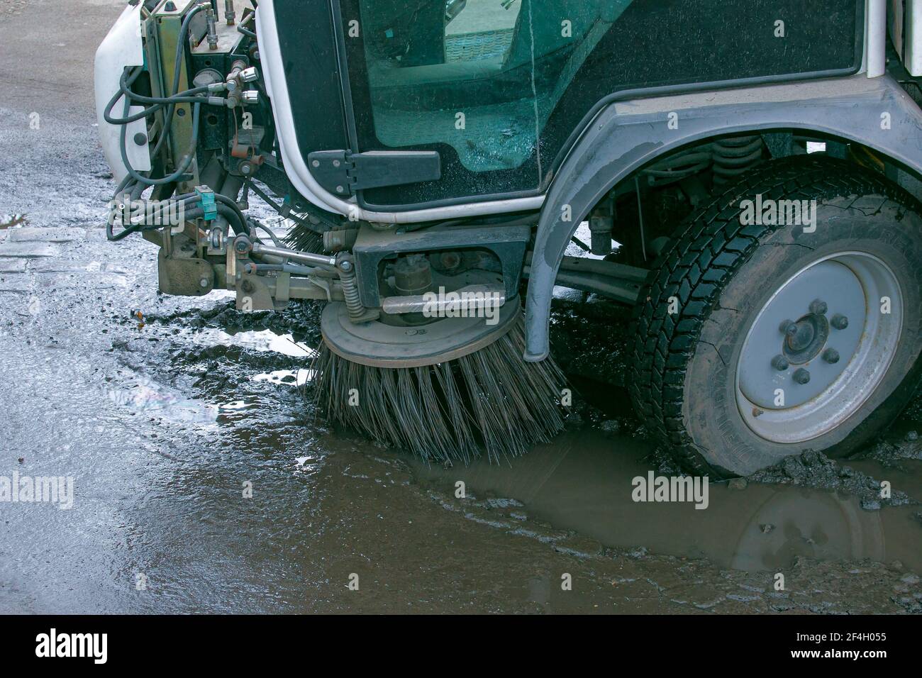 Street cleaning machine sweeping pavement hi-res stock photography and ...