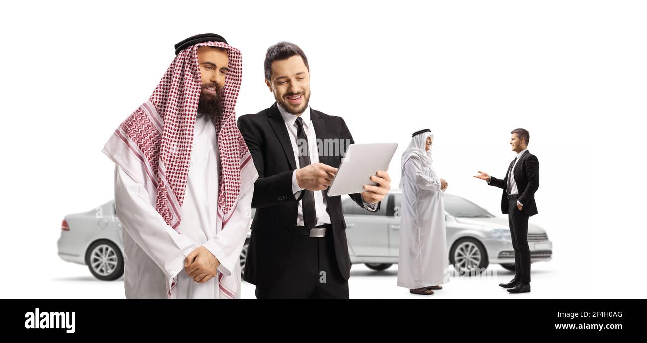 Car salesman showing a digital tablet to a saudi arab man isolated on ...
