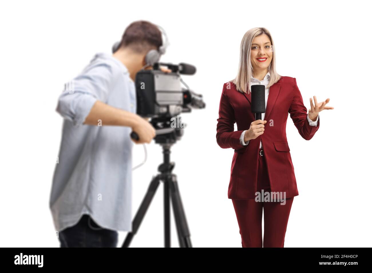 Cameraman recording a female reporter with a microphone isolated on ...