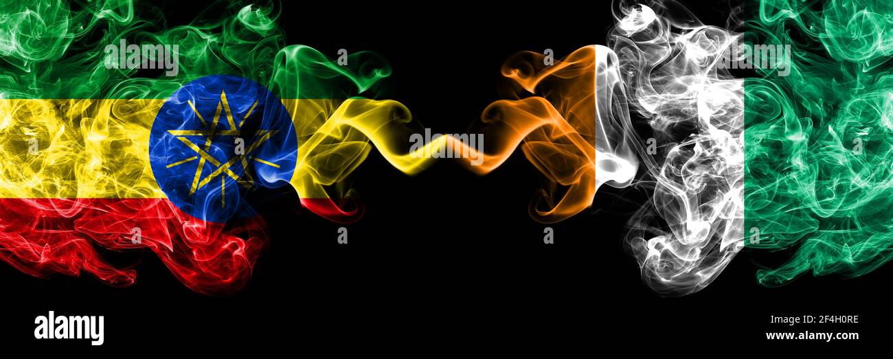 Ethiopia, Ethiopian vs Ivory Coast smoky mystic flags placed side by ...