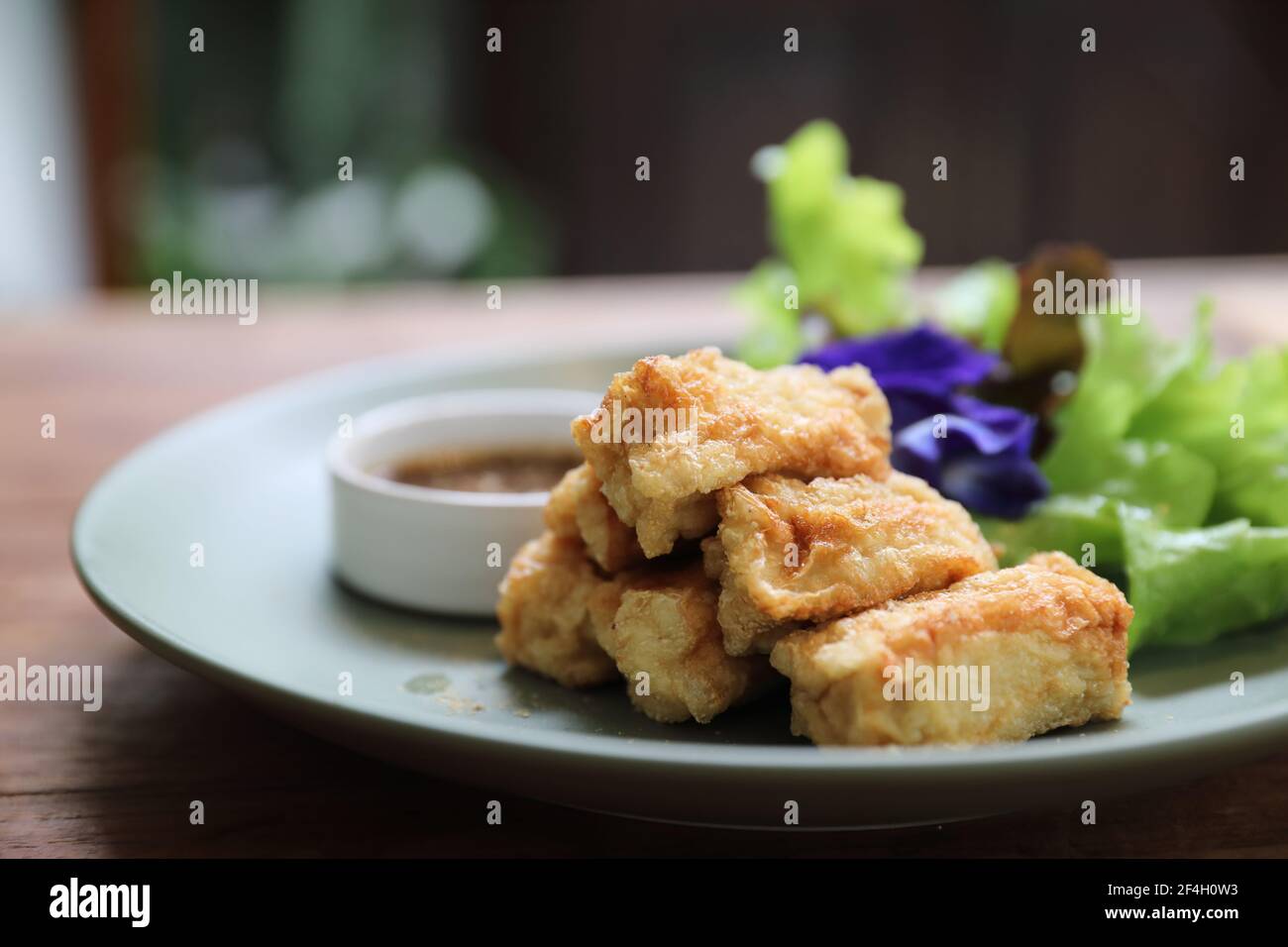 Vegan food appetizer japanese fried tofu on wood background vintage ...
