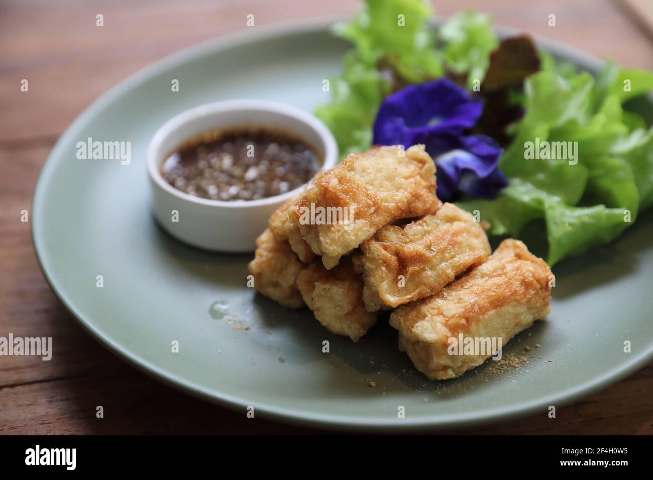 Vegan food appetizer japanese fried tofu on wood background vintage ...
