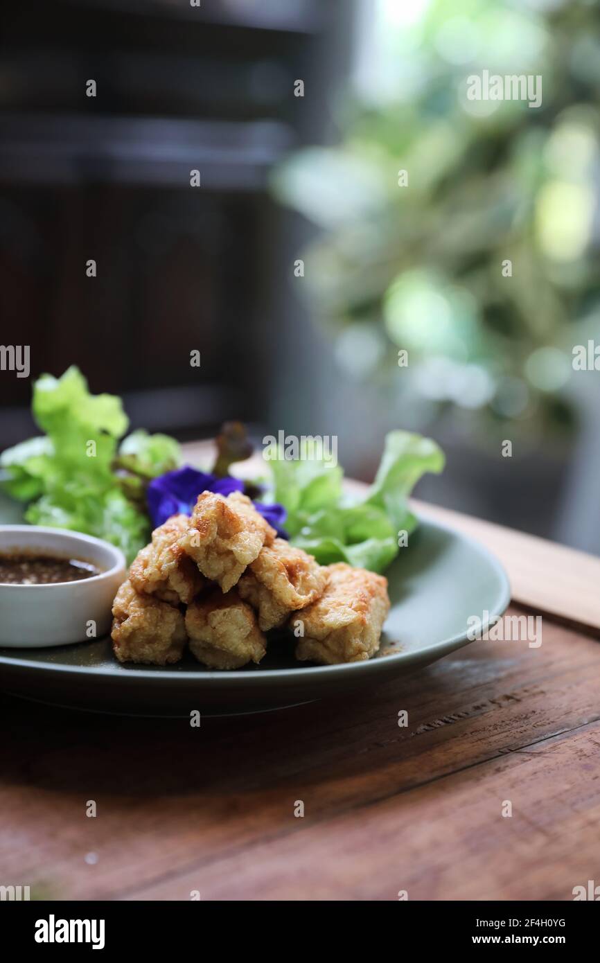 Vegan food appetizer japanese fried tofu on wood background vintage ...