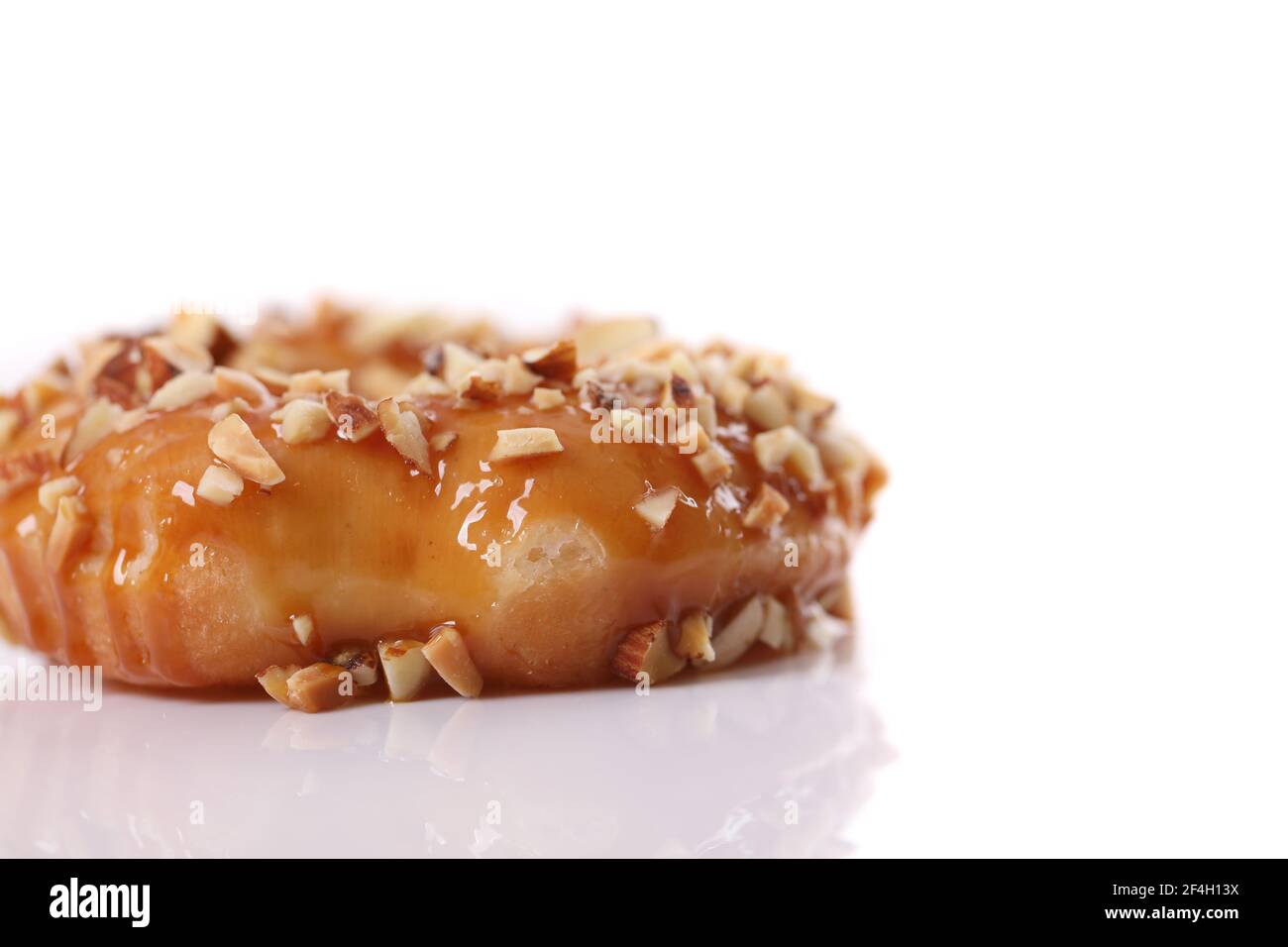 Donut with nut isolated on white background Stock Photo - Alamy