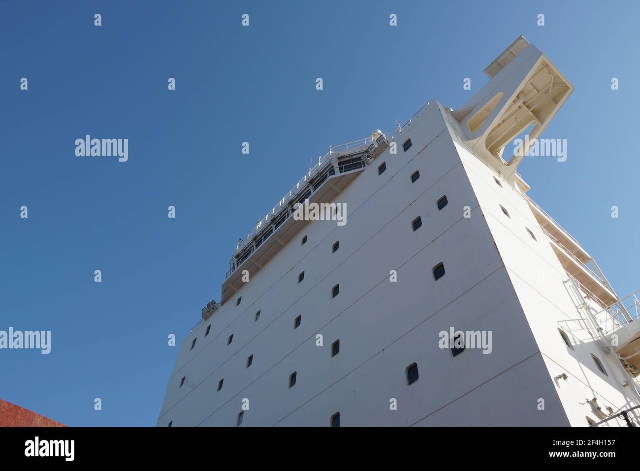 View on the white superstructure with navigational bridge of the ...