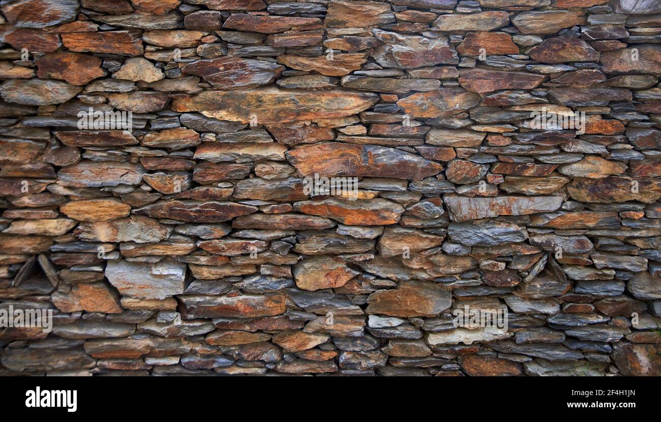 Natural stone wall. Wall built with natural stones. Stones texture ...