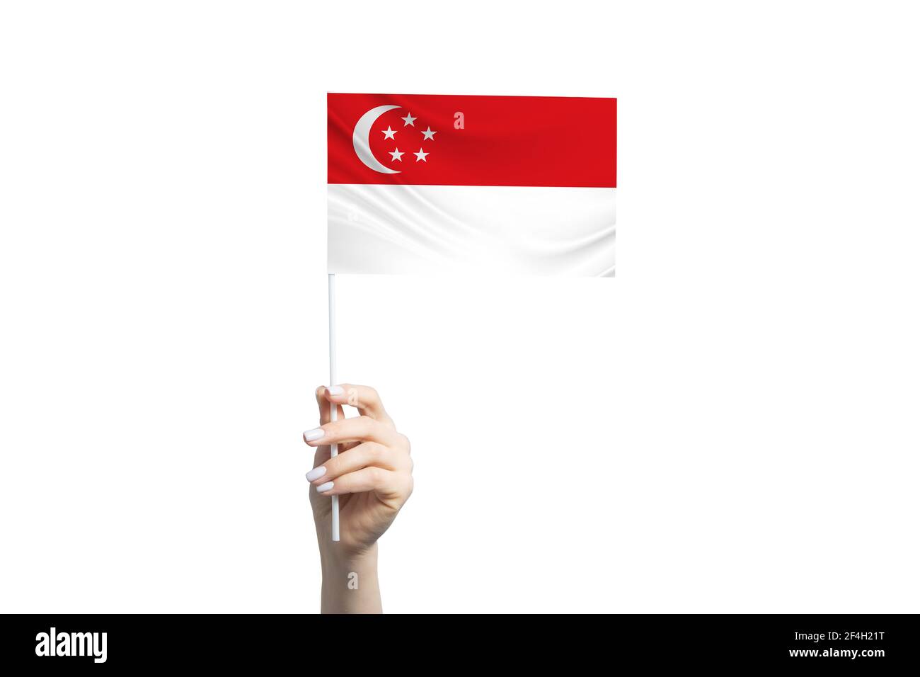 Beautiful female hand holding Singapore flag, isolated on white background Stock Photo - Alamy