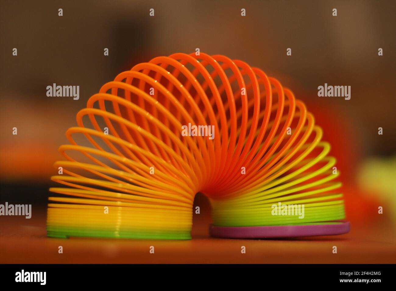 bright color slinky toy closeup Stock Photo - Alamy
