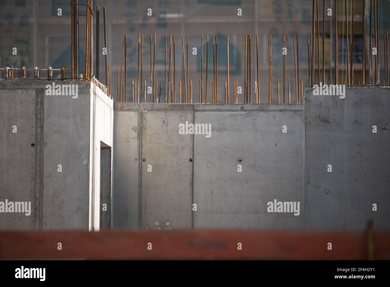 Construction site with a concrete slab and walls reinforced with steel ...