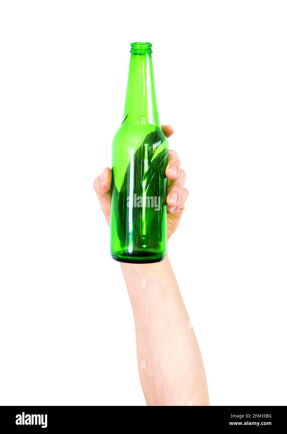 A person's raised hand holding a glass bottle isolated on a white ...