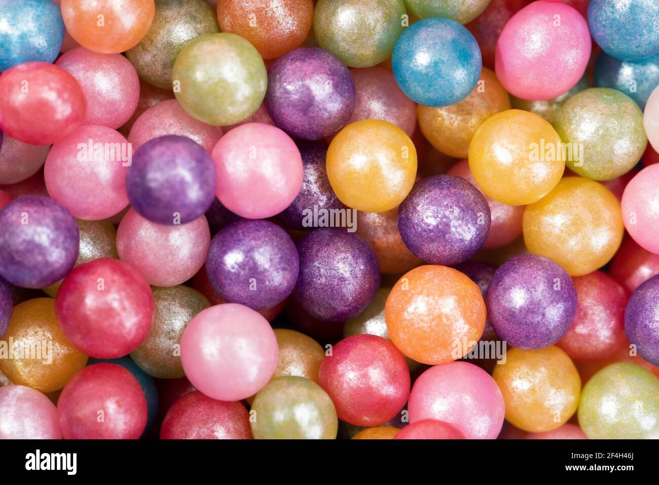 A closeup shot of colorful sweet candy balls Stock Photo - Alamy