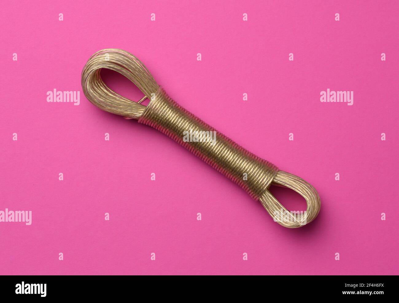 twisted clothesline on pink background, top view Stock Photo - Alamy
