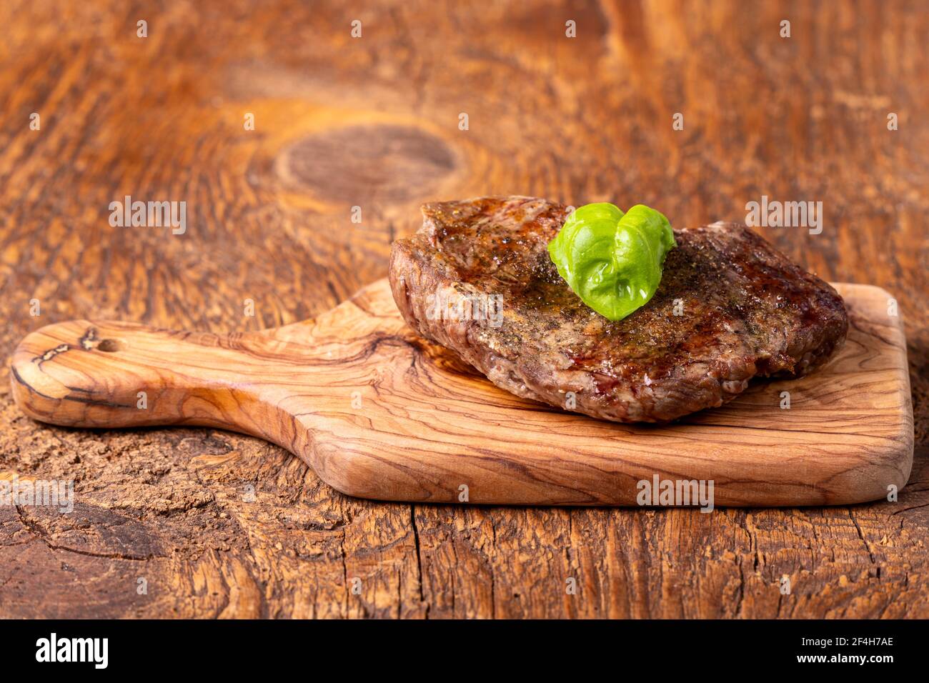 overview of a grilled steak on wood Stock Photo - Alamy