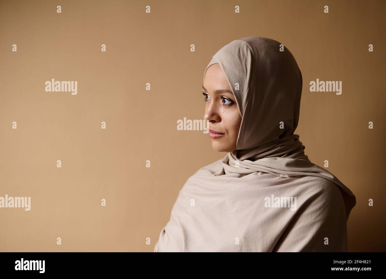 Closeup shot with soft shadow of serene elegant Arab Muslim woman in ...