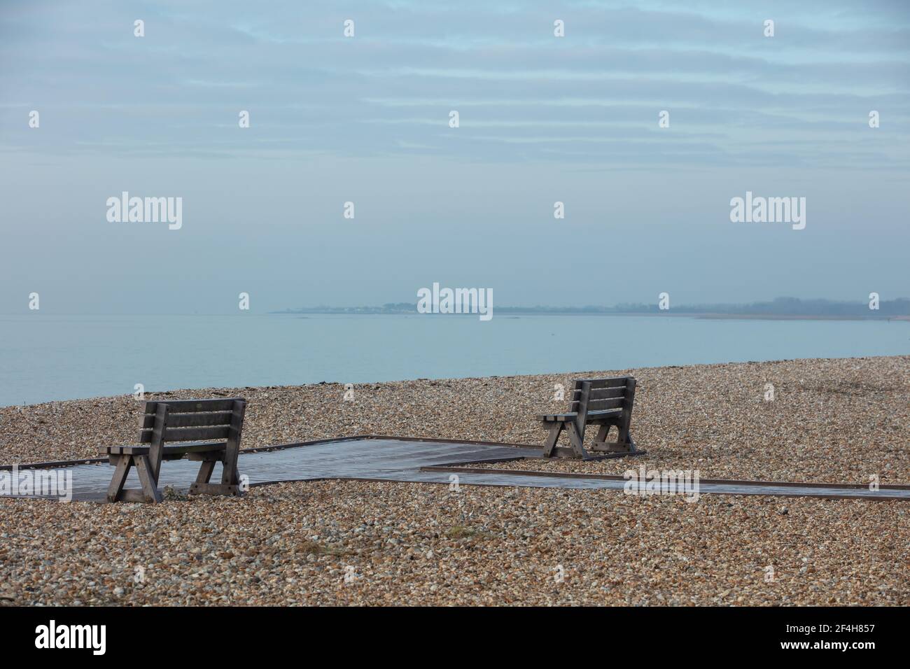 Benches seen on the beach overlooking the sea Stock Photo - Alamy