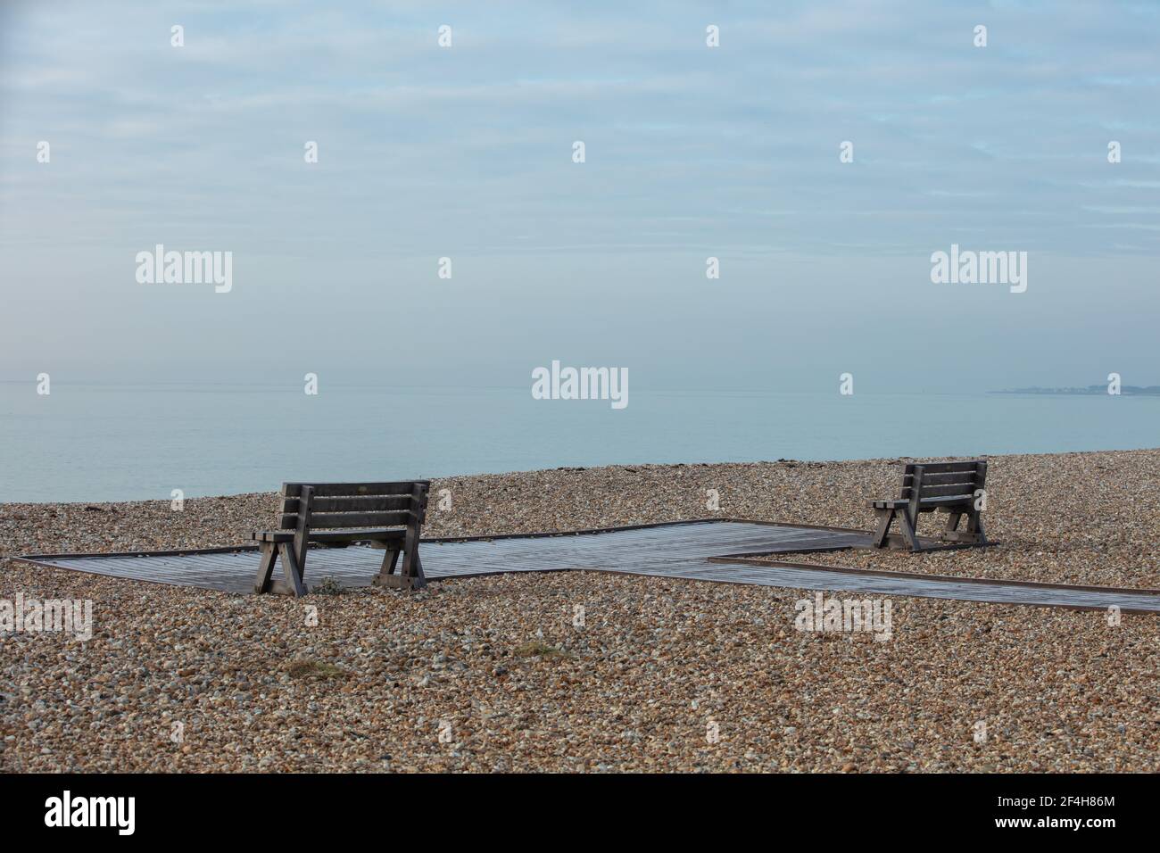 Benches seen on the beach overlooking the sea Stock Photo - Alamy