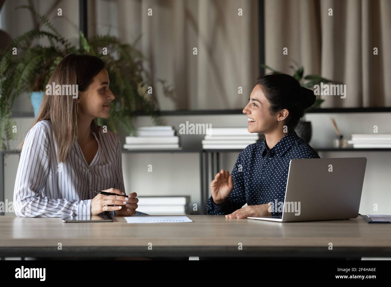 Diverse female colleagues cooperate hi-res stock photography and images ...