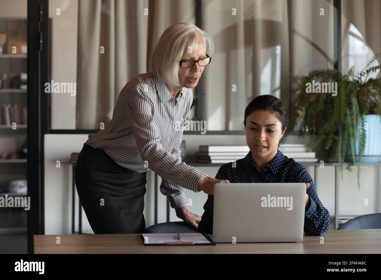 Multiracial businesspeople brainstorm working in computer in office ...