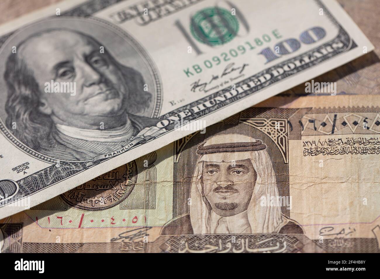 old one riyal of Saudi Arabia and 100 US dollar banknotes for design ...