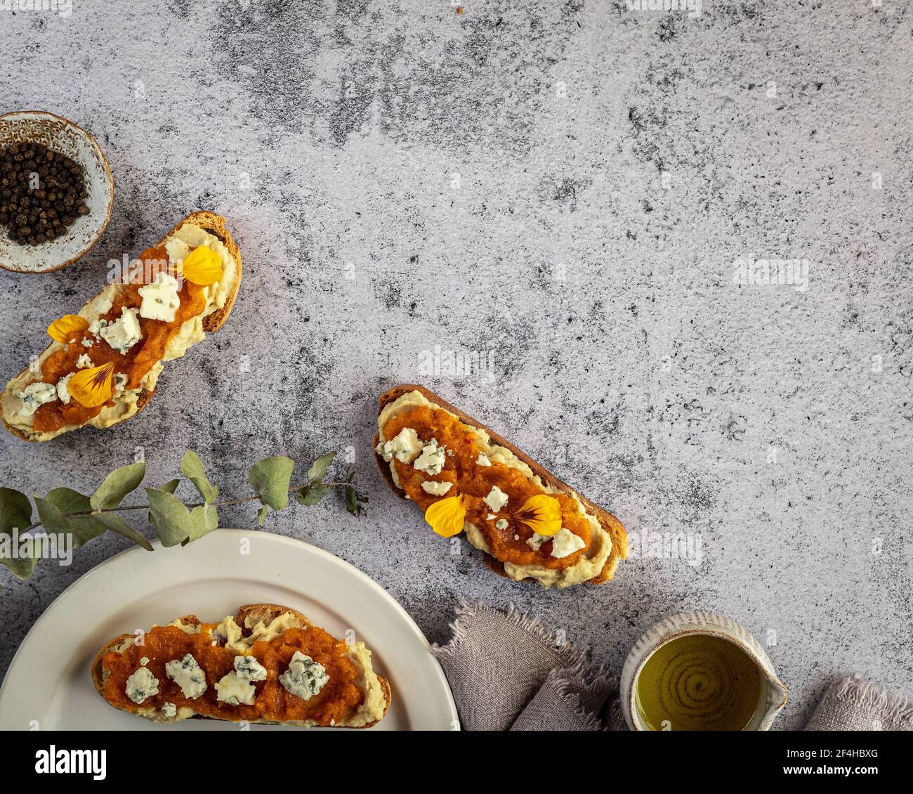 Top view appetizing fresh toasts with jam and goat cheese served on ...