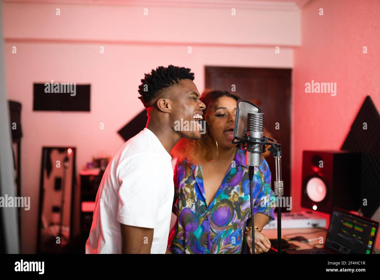 Young African American vocalists with Afro hairstyle and closed eyes ...