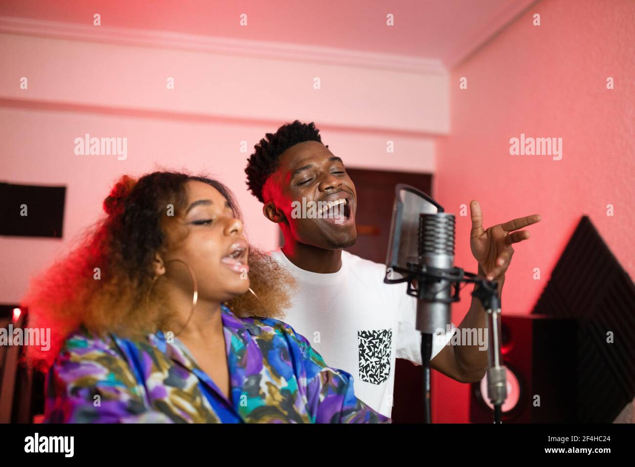 Young African American vocalists with Afro hairstyle and closed eyes ...