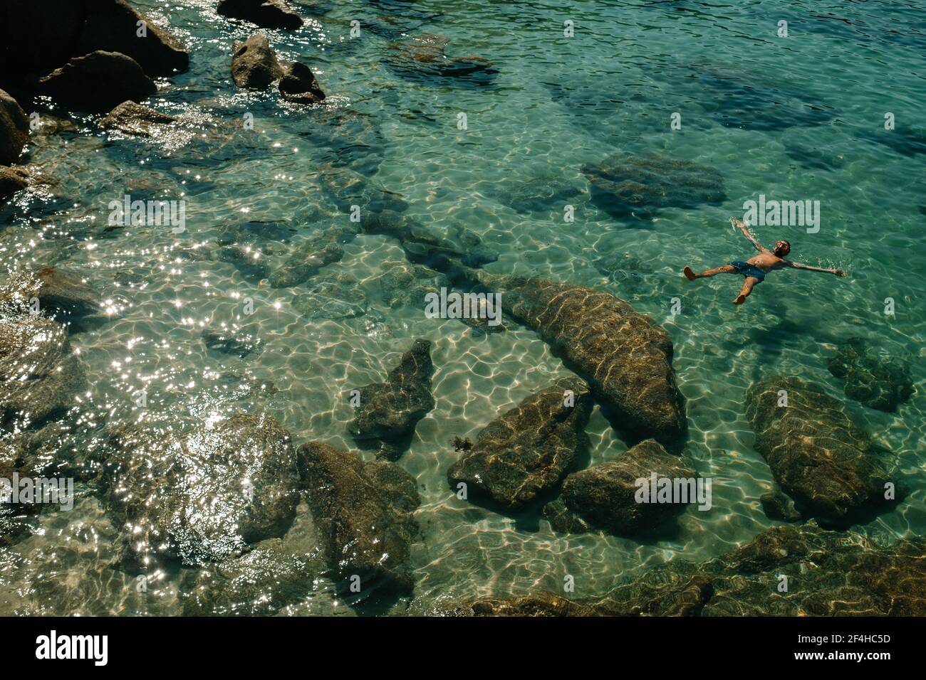 man floating in the the sea during summer Stock Photo - Alamy