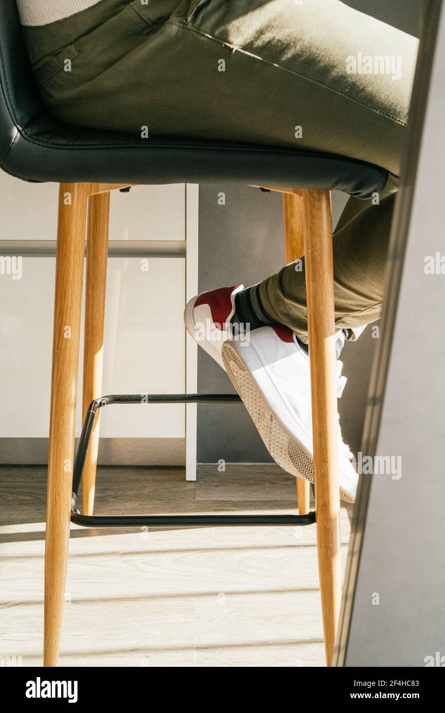 Feet on stool hi-res stock photography and images - Alamy