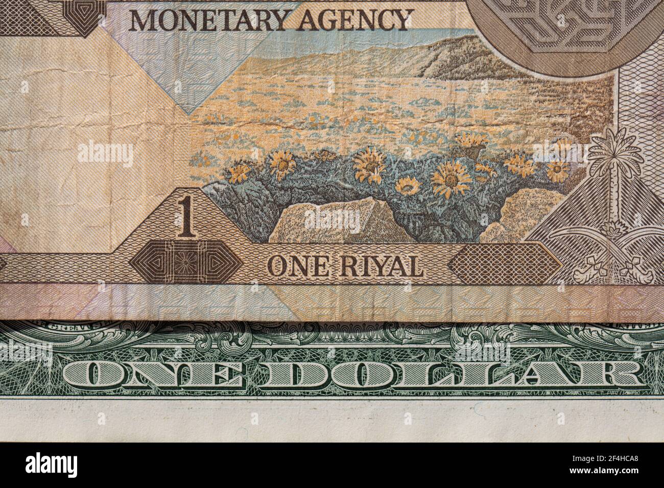 old one riyal of Saudi Arabia and 1 US dollar banknotes for design ...