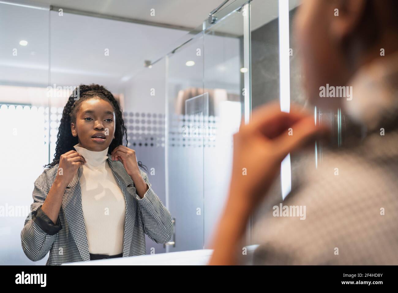 Back view of crop self assured happy young black female millennial in ...
