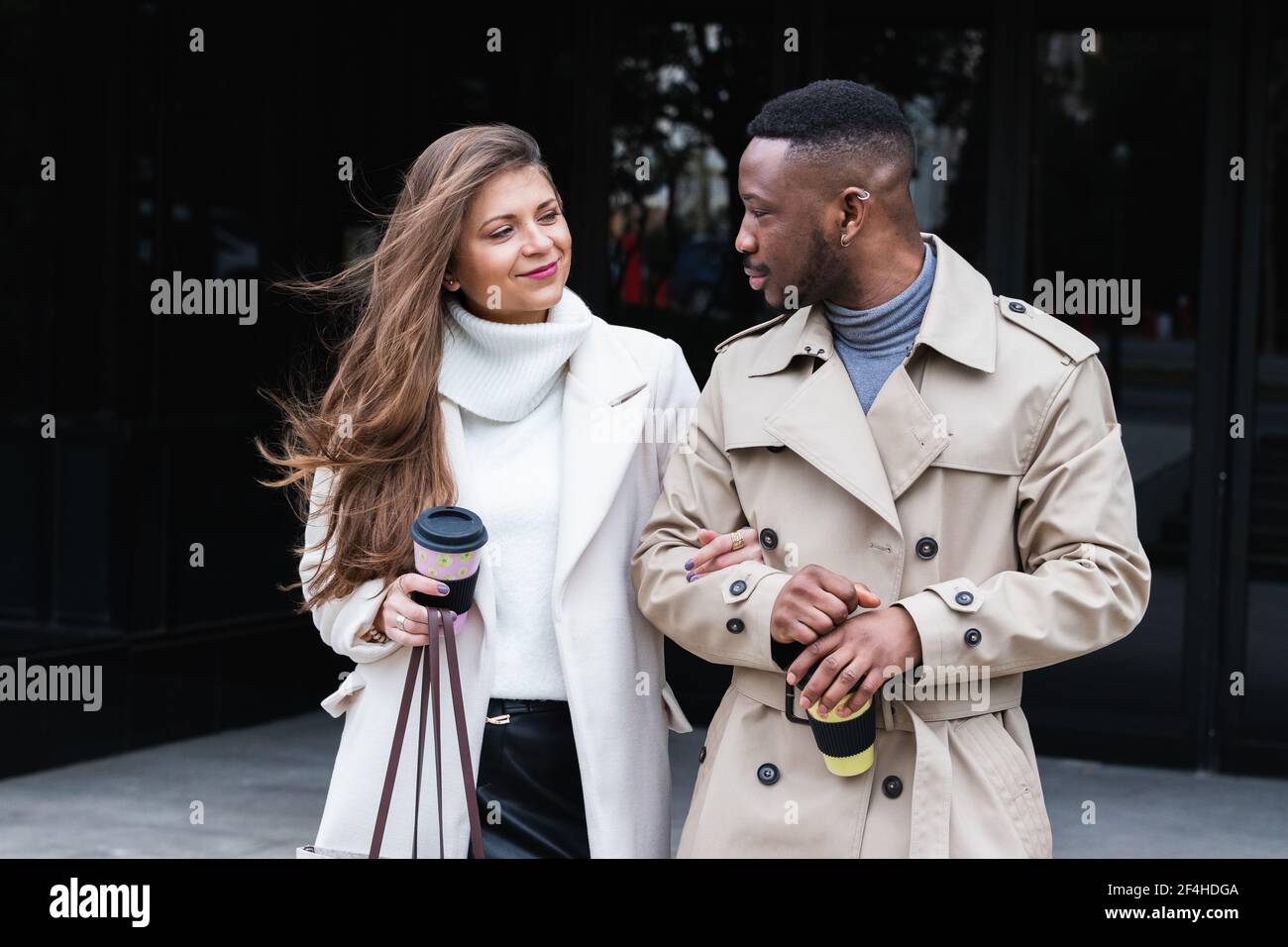 Positive couple in coats hi-res stock photography and images - Alamy