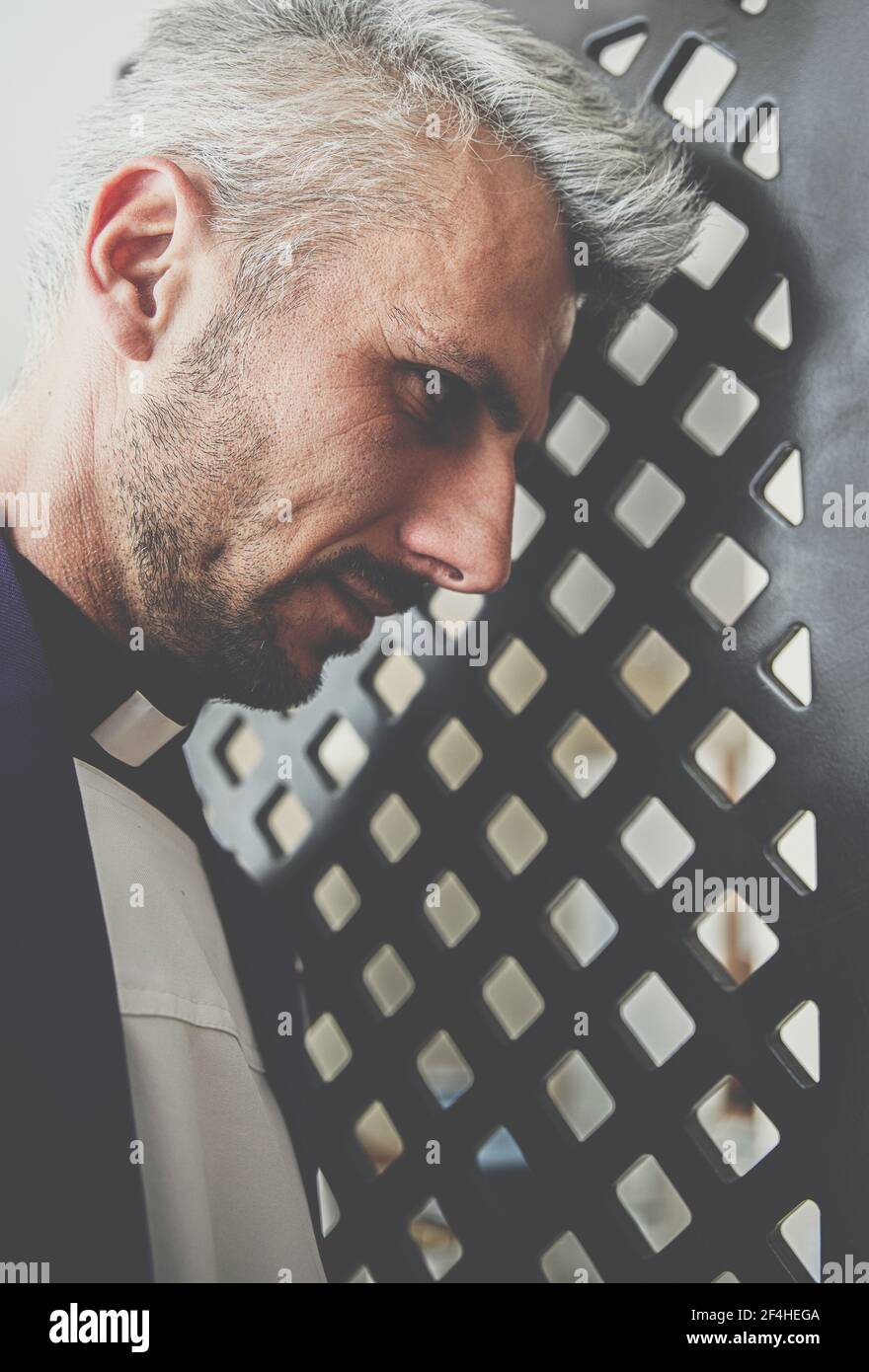 Catholic priest confessives in the confessional. Confession of sins ...