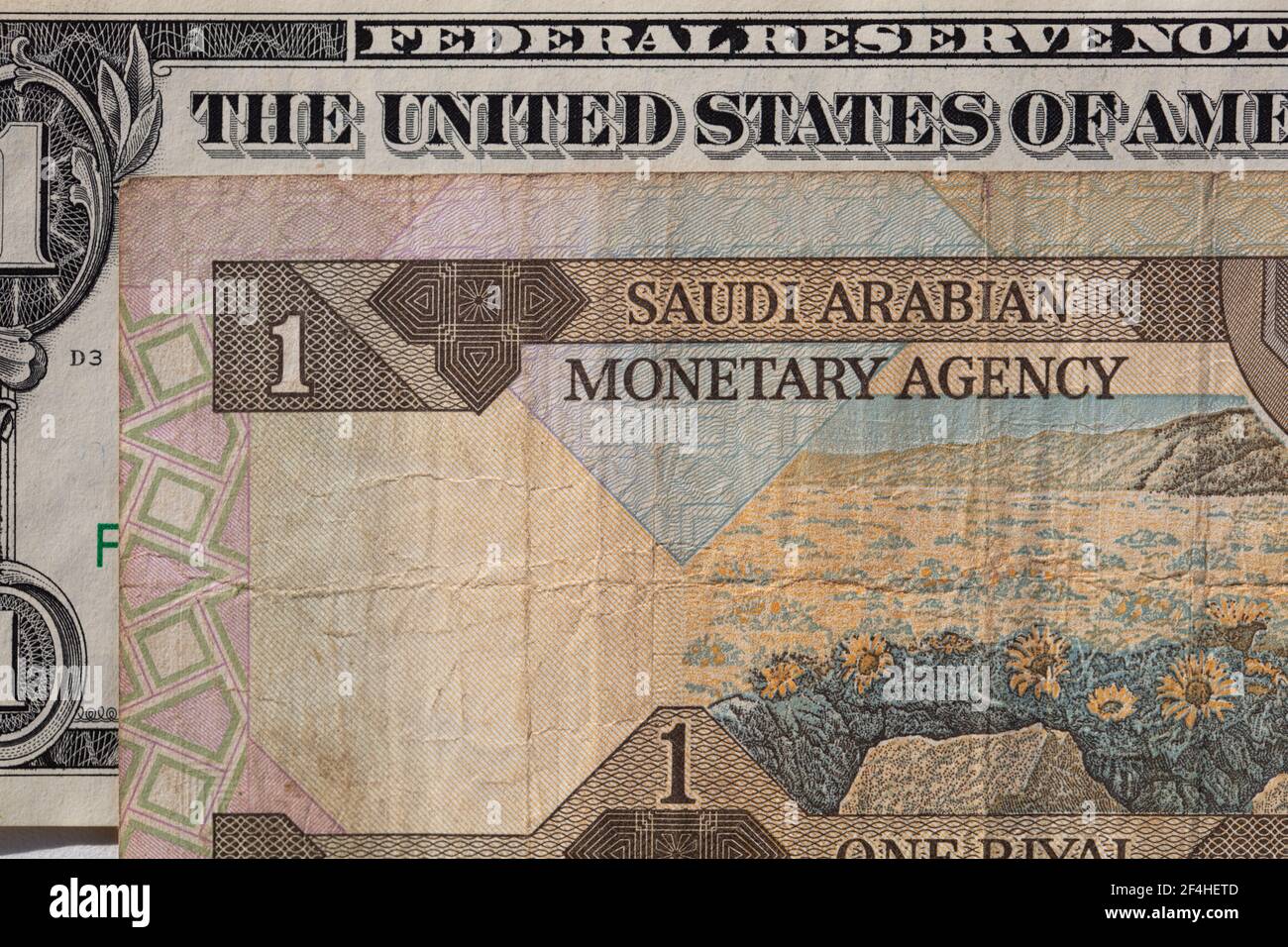 old one riyal of Saudi Arabia and 1 US dollar banknotes for design ...