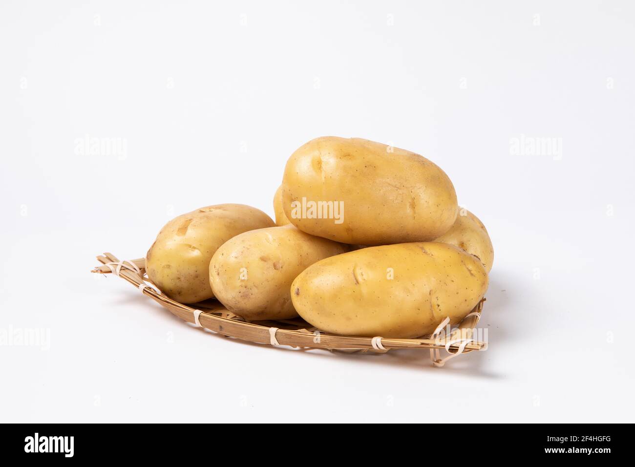 The fresh raw potatoes isolated on white background Stock Photo - Alamy