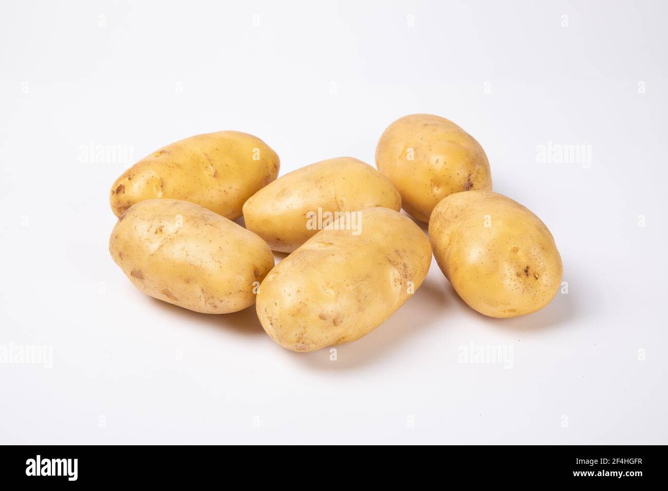 The fresh raw potatoes isolated on white background Stock Photo - Alamy