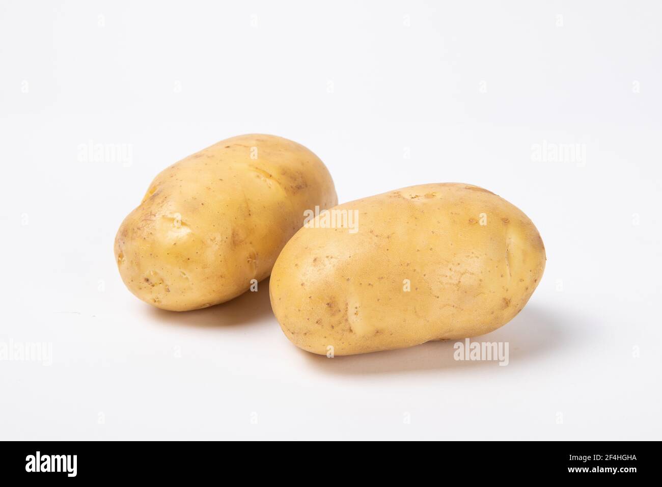 The fresh raw potatoes isolated on white background Stock Photo - Alamy