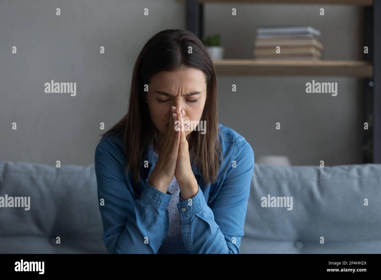 Close up unhappy desperate woman praying at home, asking help Stock ...