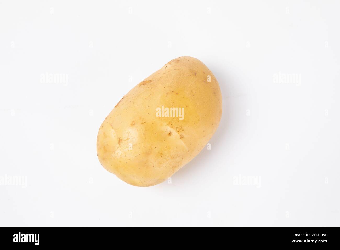 A single fresh raw potato isolated on white background Stock Photo - Alamy