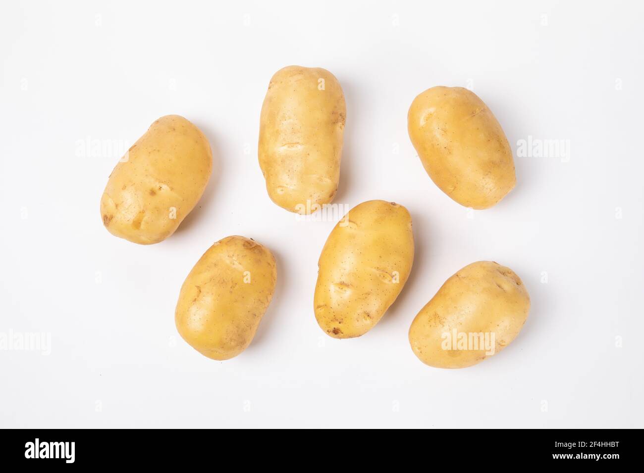 The fresh raw potatoes isolated on white background Stock Photo - Alamy