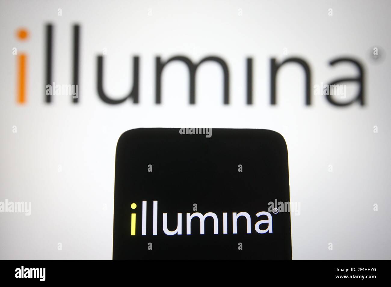 In this photo illustration an Illumina logo is seen on a smartphone and ...