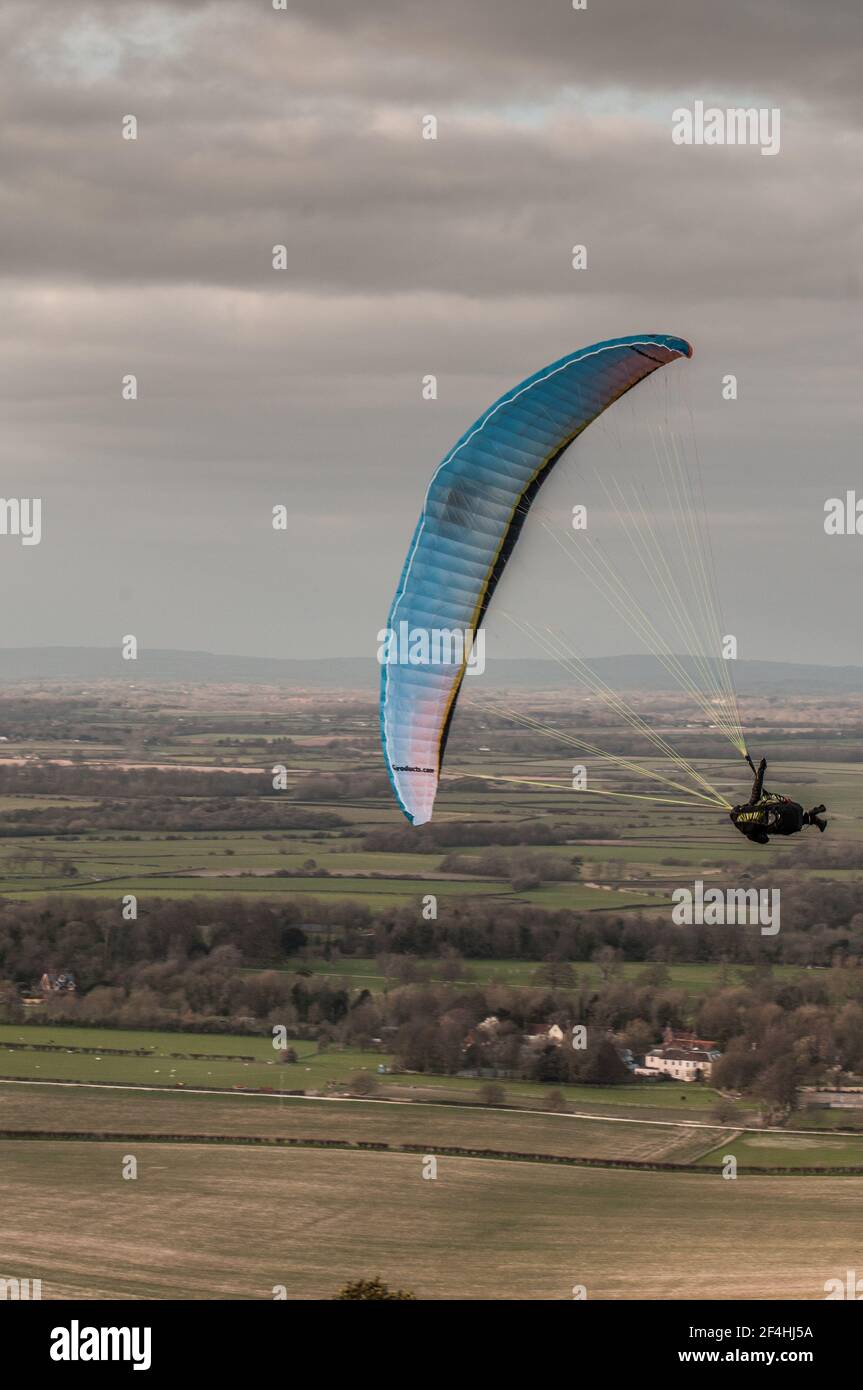 Firle, Lewes, East Sussex, UK. 21st Mar, 2021. Paragliders take to the ...
