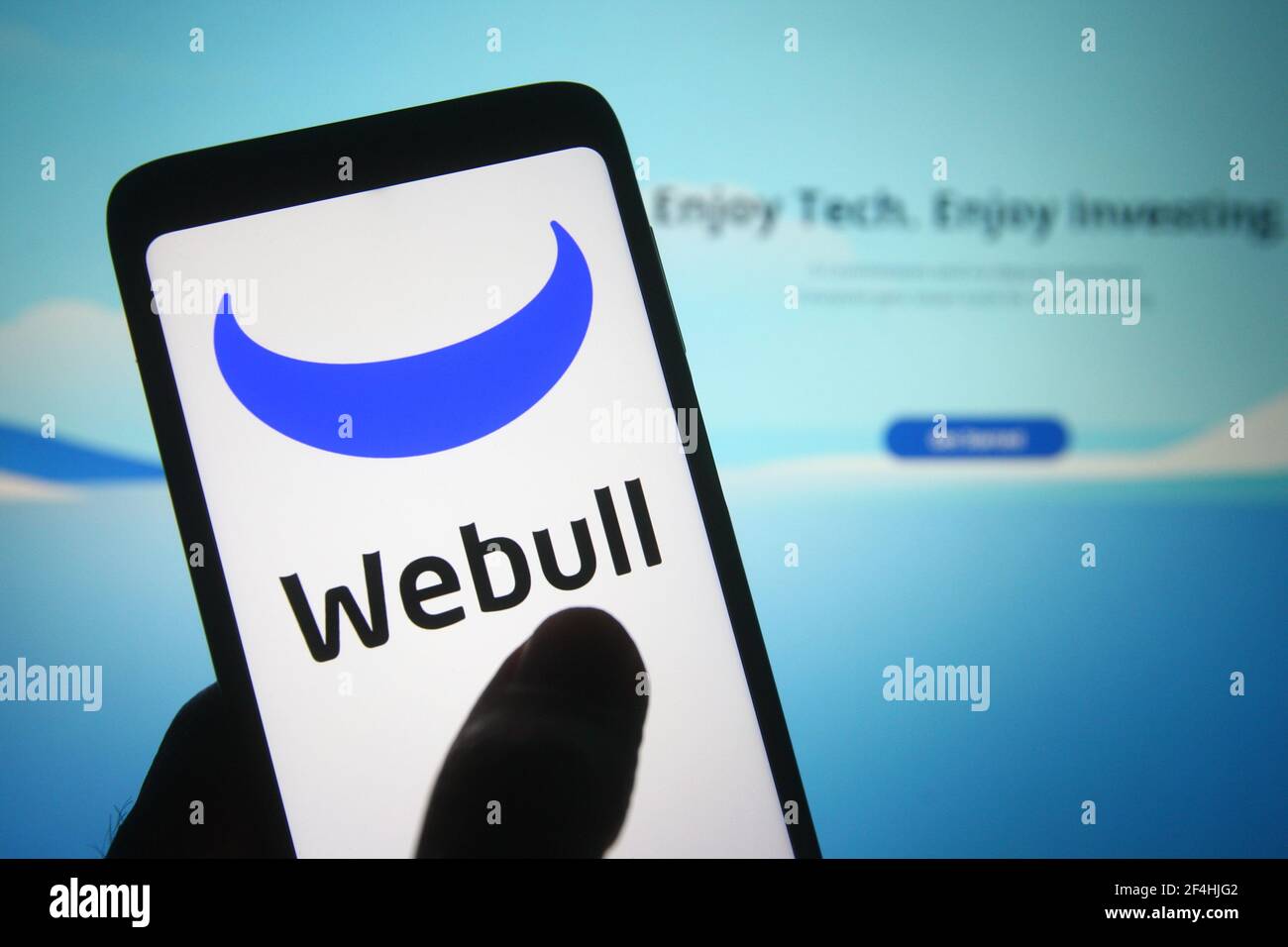 In this photo illustration a Webull logo of a financial services ...