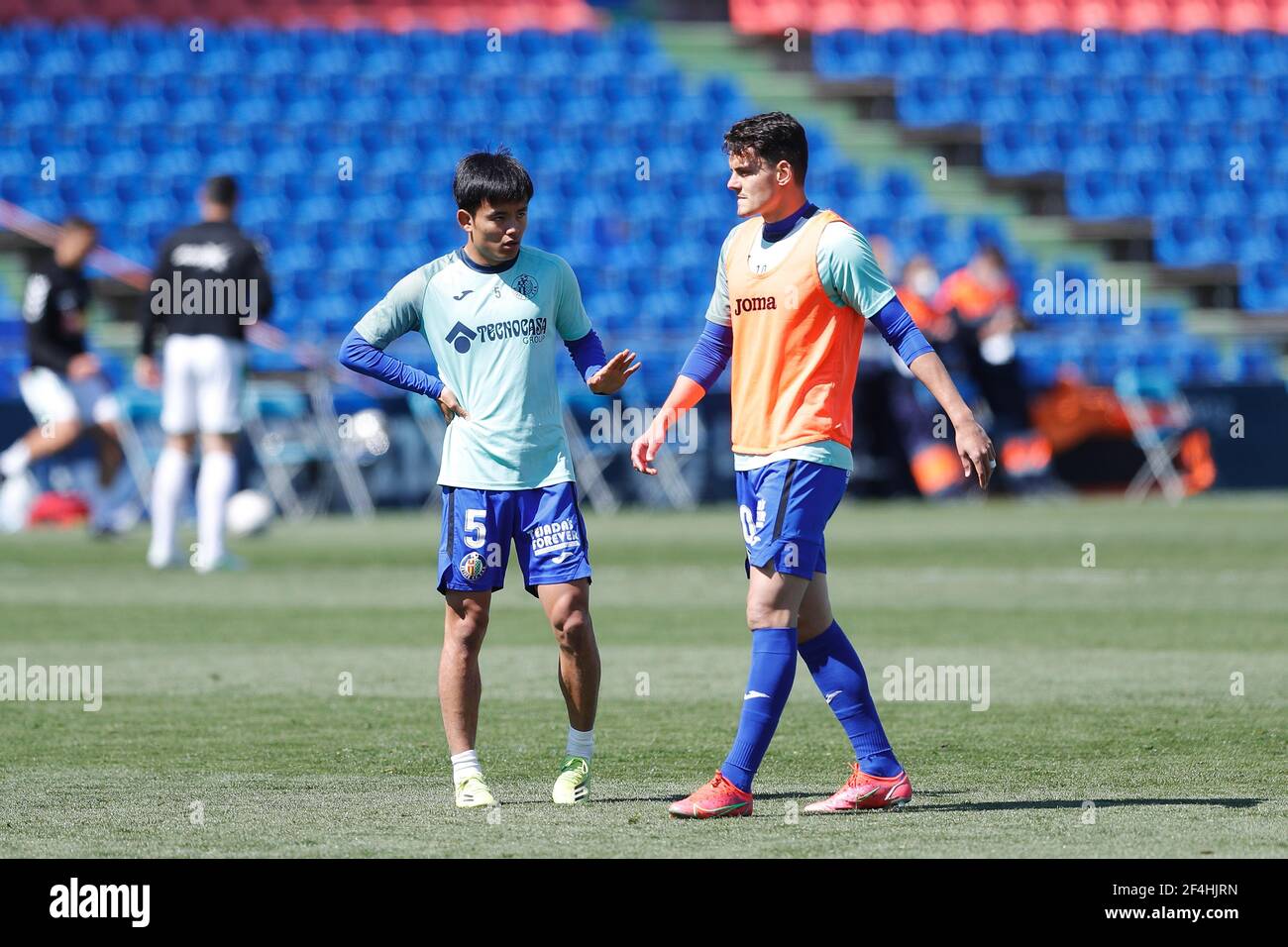 Getafe, Spain. 21st Mar, 2021. (L-R) Takefusa Kubo, Enes Unal (Getafe ...