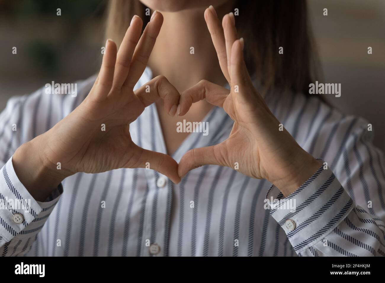 Close Up Woman Showing Heart Sign Gesture Expressing Gratitude Stock